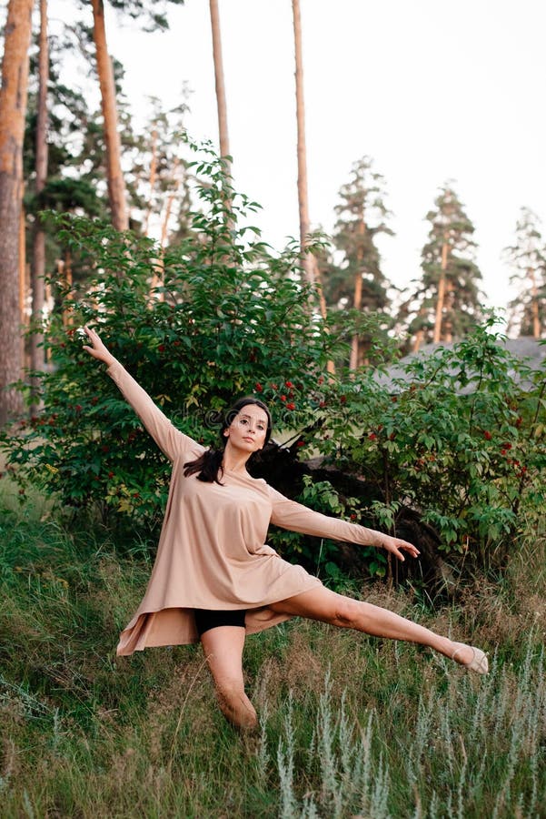Girl Dancing in the Summer in a Pine Forest Stock Photo - Image of ...