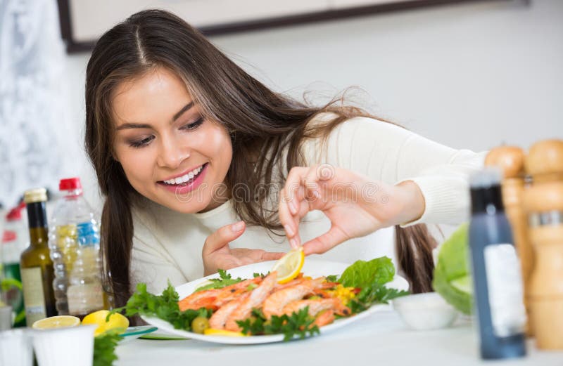 Girl Decorating Fried Fish on Plate Stock Image - Image of casual ...