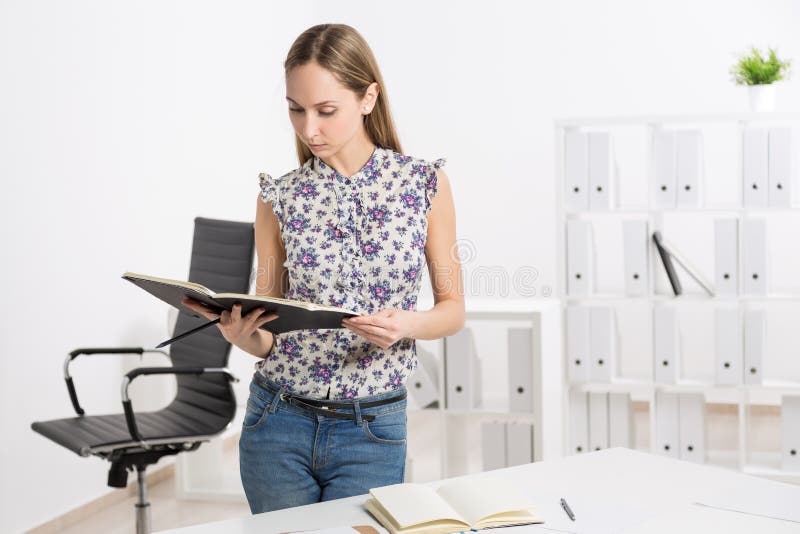 Girl with diary in hands stock image. Image of desk, brainstorming ...