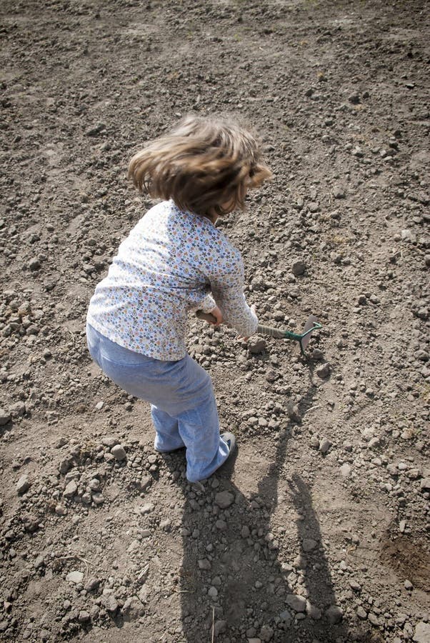 Girl Digging Snow on the Ground by Shovel Stock Photo - Image of ...