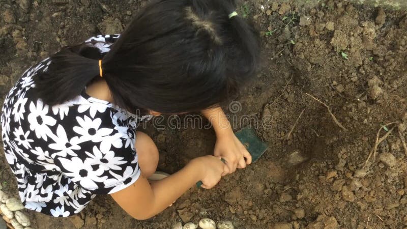 Girl Digging in the Sand on the Beach. Having Fun and Joy Concept ...