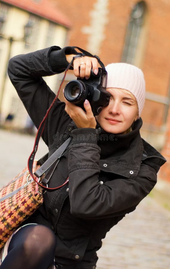 Girl with a digital camera stock photo. Image of pointing - 3307044