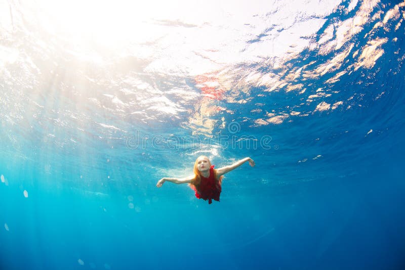 Girl diving under the sea stock image. Image of bright - 39654587