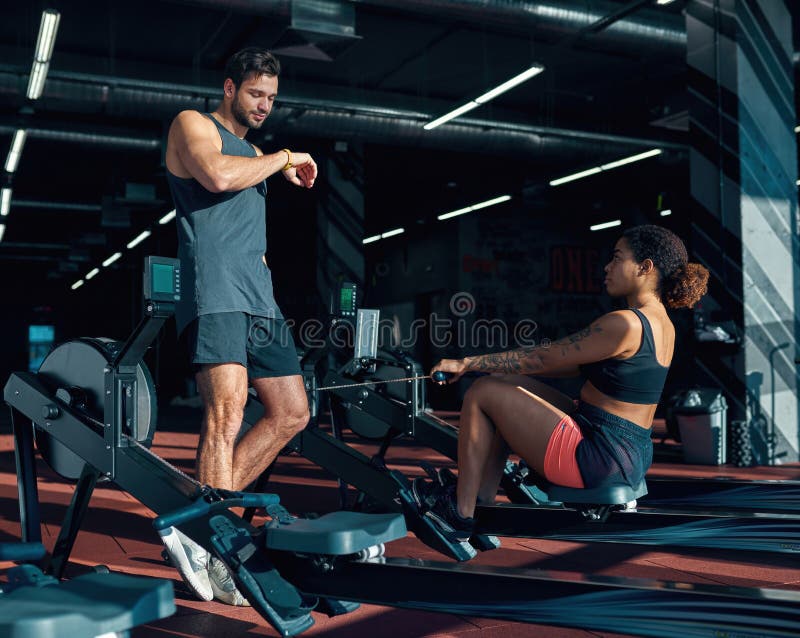 Girl Do Exercise for Back and Look at Trainer Stock Photo - Image of ...