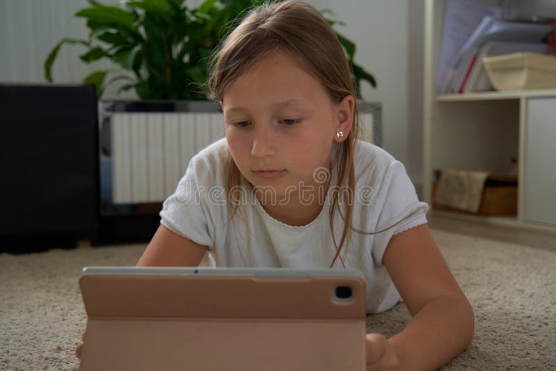 A Girl Does Her Homework on a Tablet Stock Image - Image of girl ...