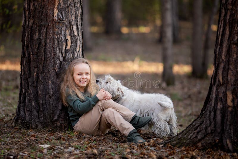 Girl and Dog are Sitting Under the Tree in the Park Stock Photo - Image ...