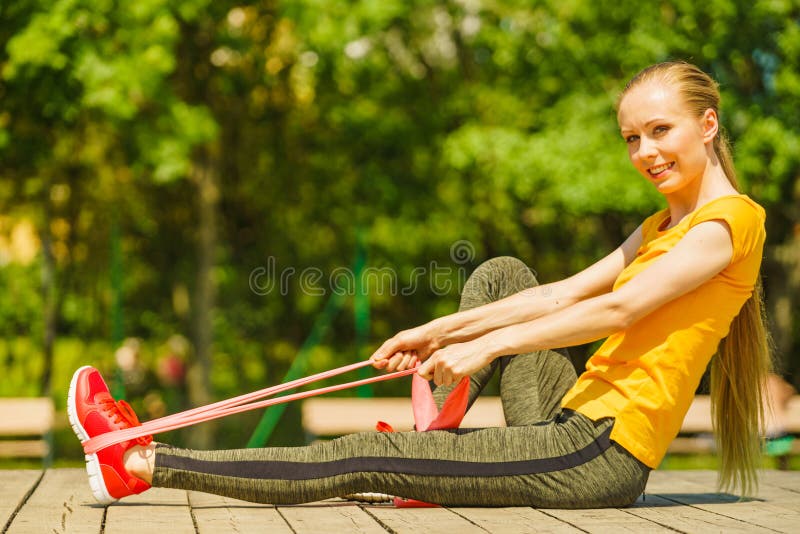 Girl Doing Exercise Outdoor, Using Resistance Fit Band Stock Photo ...