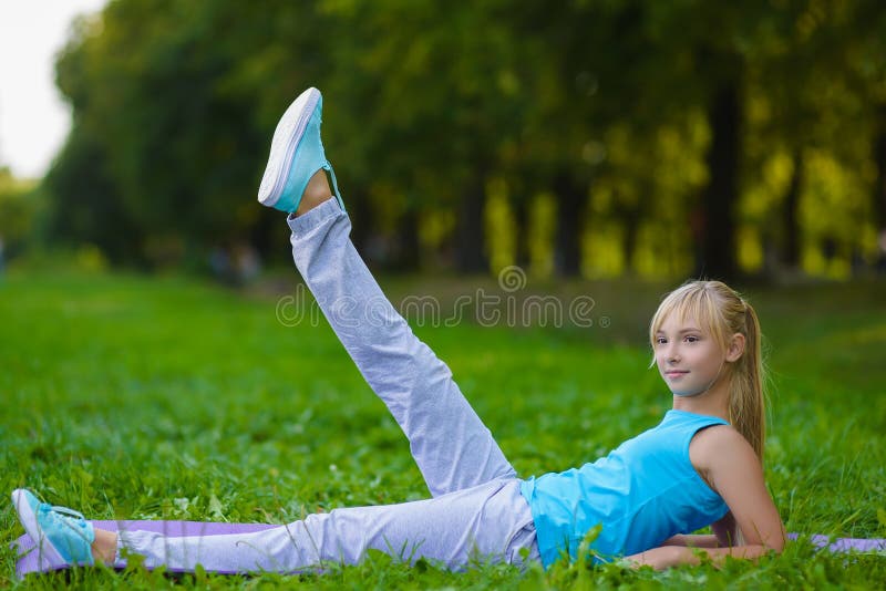 Girl Doing Gymnastic Exercises or Exercising Outdoor Stock Photo ...