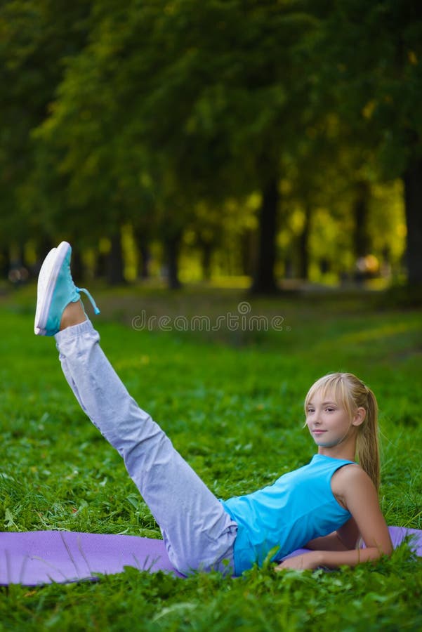 Girl Doing Gymnastic Exercises or Exercising Outdoor Stock Photo ...