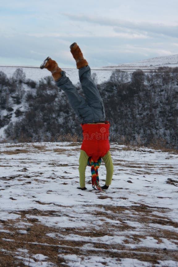 Girl doing handstand stock photo. Image of snowy, playful - 8100948