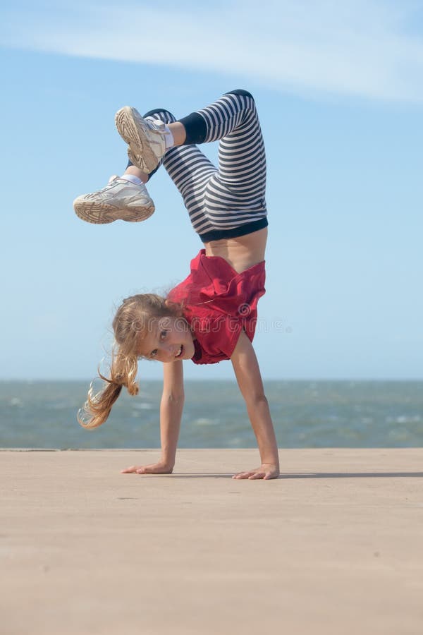 Girl doing handstand stock photo. Image of vacation, happiness - 35674096