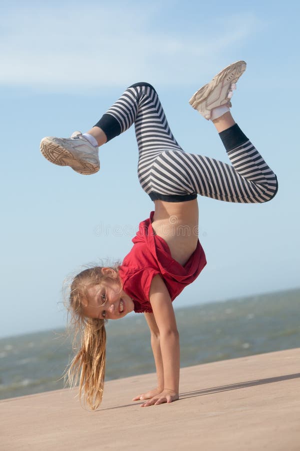 6+ Young girl doing handstand Free Stock Photos - StockFreeImages