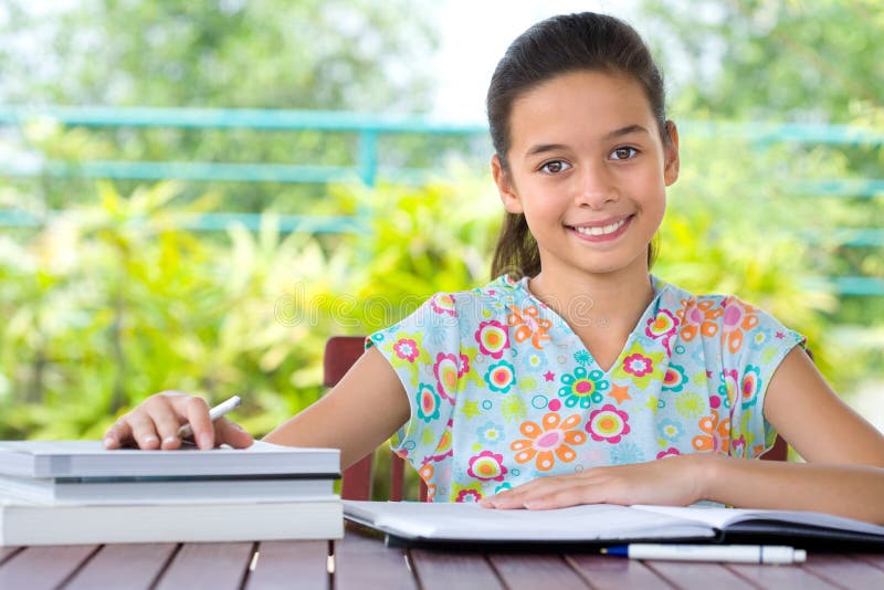 Girl doing her homework. stock image. Image of master - 8212813