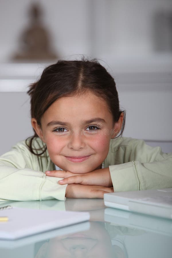 Girl doing her homework stock photo. Image of desk, caucasian - 33951626