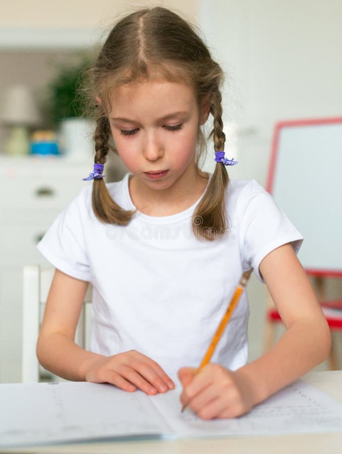 Girl doing homework. stock image. Image of beautiful - 67883863