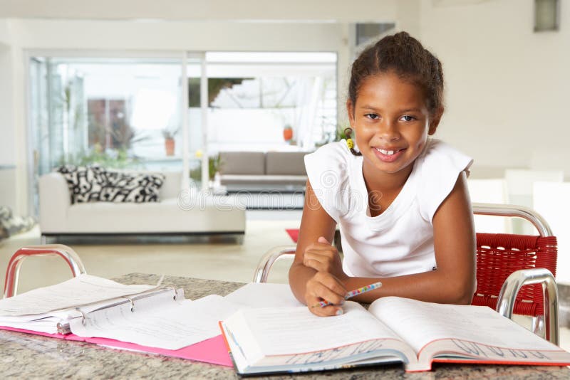 Girl Doing Homework in Kitchen Stock Image - Image of camera, looking ...