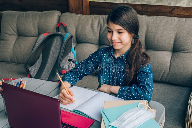 Girl Doing Homework Looking at the Computer Stock Photo - Image of ...
