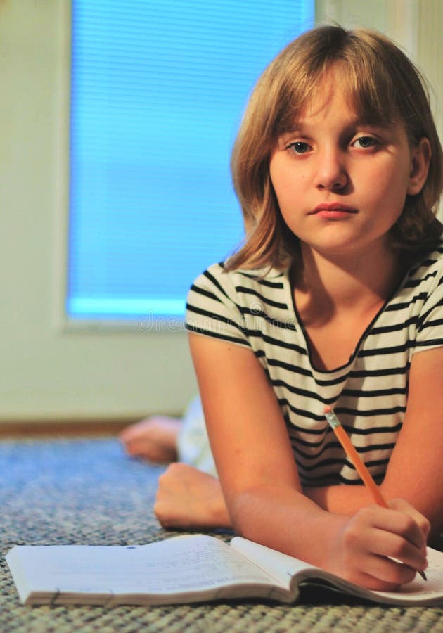 Girl Doing Homework with Pencil and Notebook Stock Image - Image of ...