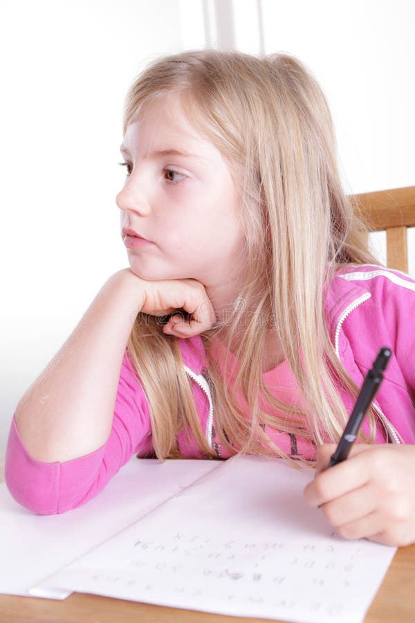 Child doing her homework stock photo. Image of homework - 33704888