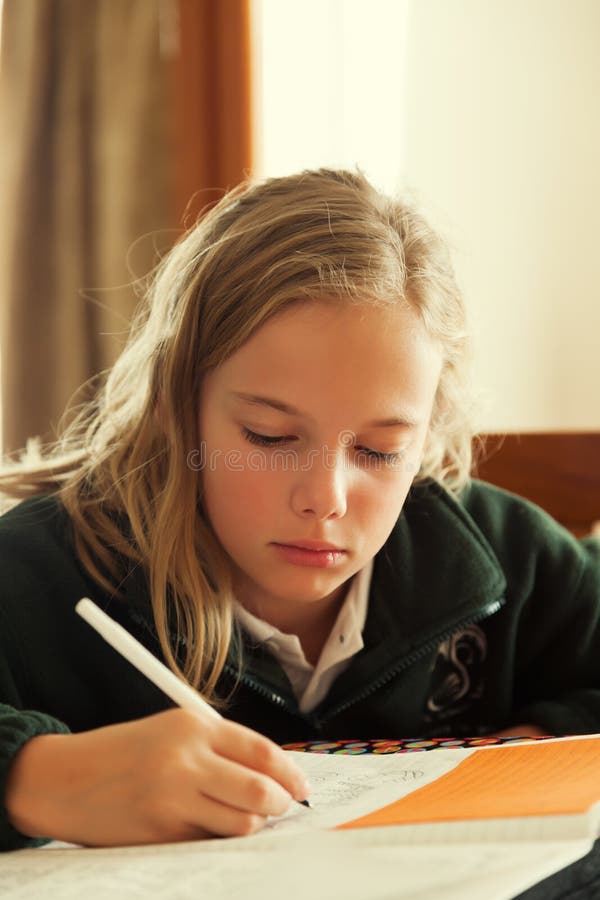 Girl doing homework stock image. Image of blonde, child - 35247307
