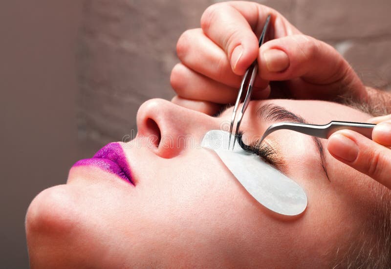 The girl doing the lashes stock image. Image of luxury - 90744221
