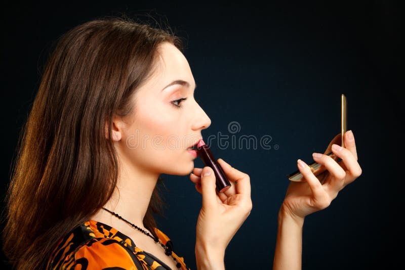 Girl doing make-up stock photo. Image of feminine, cosmetic - 13298544