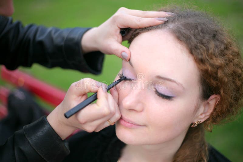 A girl doing make-up stock photo. Image of perfect, model - 24508754