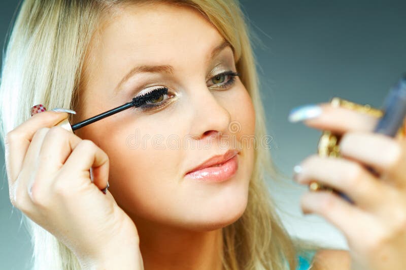 Girl doing makeup stock image. Image of healthy, cotton - 569567