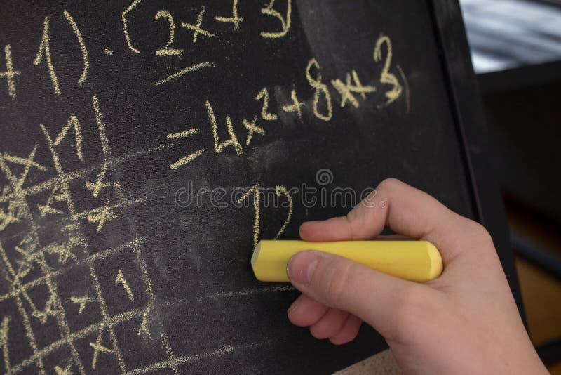 Girl Doing Math with Chalk on Blackboard. Stock Photo - Image of math ...