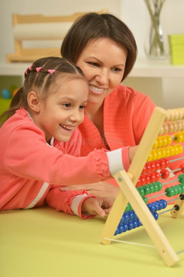 Girl Doing Math Exercises with Mother Stock Photo - Image of numeric ...