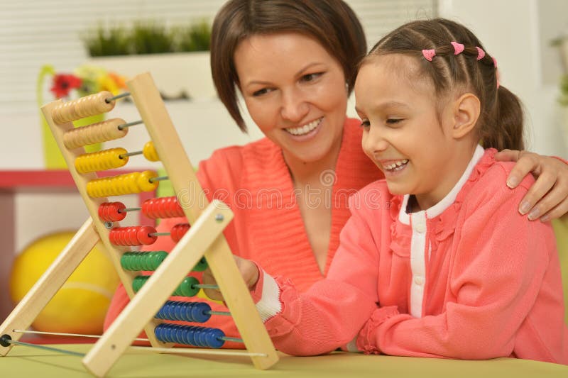 Girl Doing Math Exercises with Mother Stock Photo - Image of calculate ...