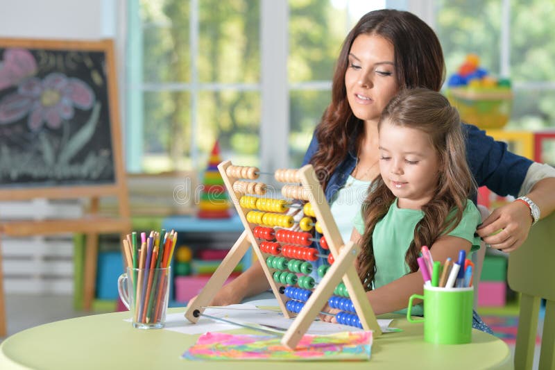 Girl doing math exercises stock image. Image of numeric - 82517889