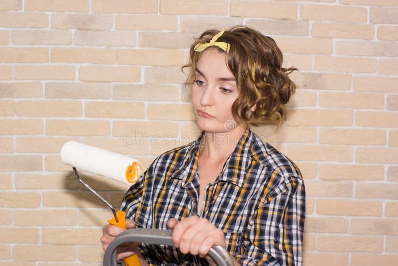 Girl doing repairs stock photo. Image of roller, fatigue - 43021260
