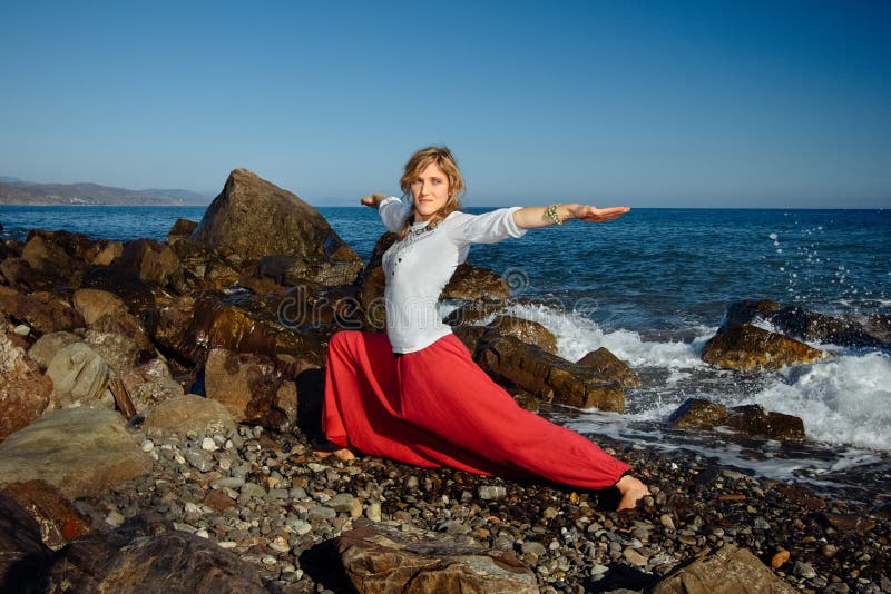 Girl Doing Yoga. Ocean in Background Stock Image - Image of active ...