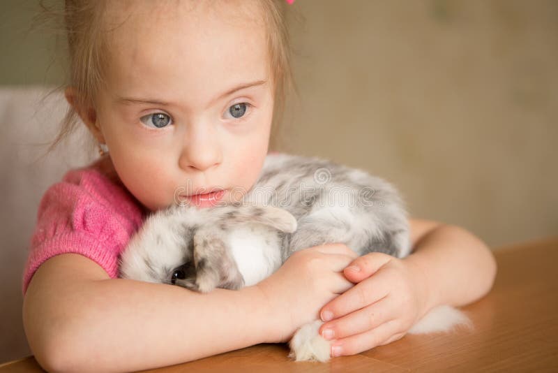 Girl with Down Syndrome Hugs the Rabbit Stock Photo - Image of 21st ...