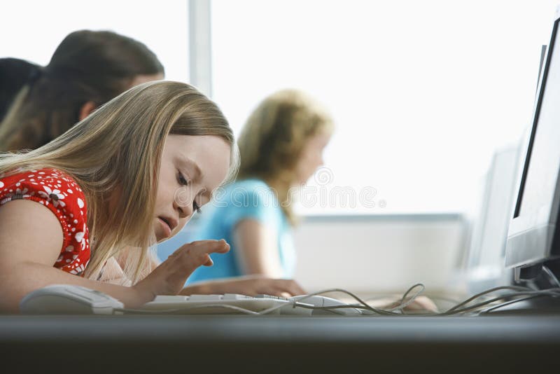 Girl (10-12) with Down Syndrome Using Computer in Computer Lab Children ...