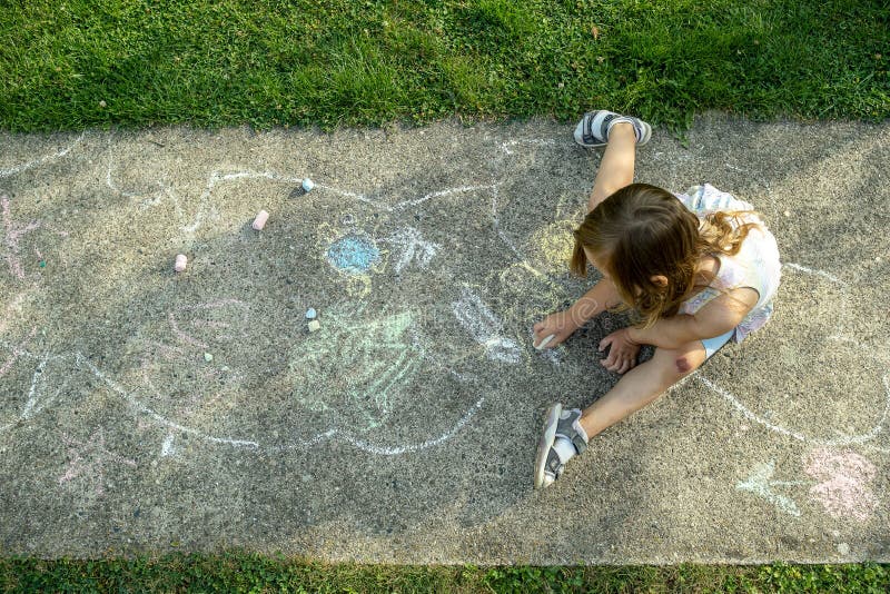 Girl Drawing with Chalk on the Ground Stock Photo - Image of caucasian ...