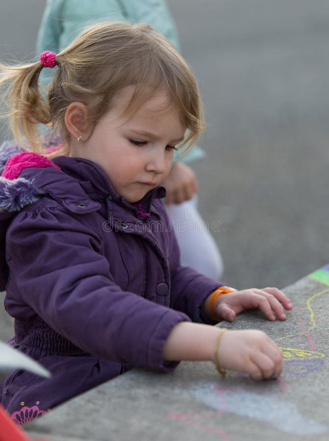 Girl drawing with chalk stock image. Image of recreational - 57500445