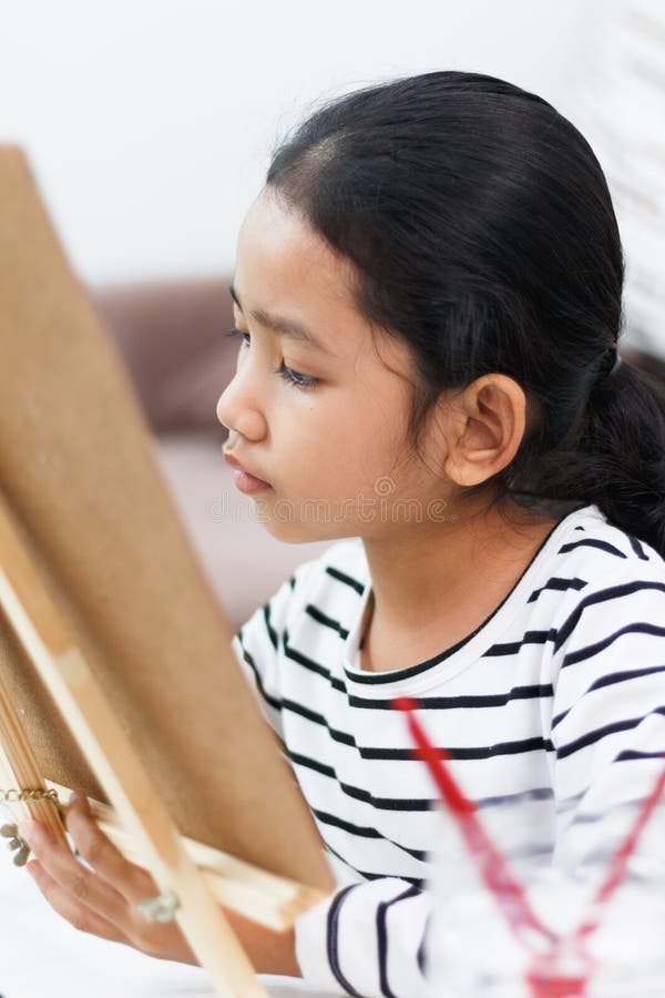 The Girl is Drawing Intently Stock Photo - Image of happy, green: 114680842