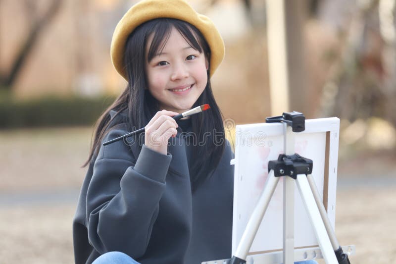 A girl drawing a picture stock photo. Image of education - 343350750