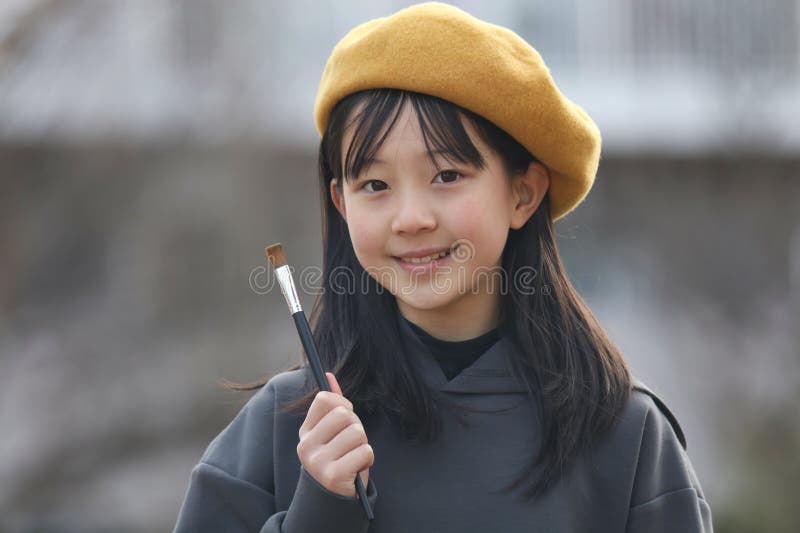 A girl drawing a picture stock photo. Image of sketch - 343350866