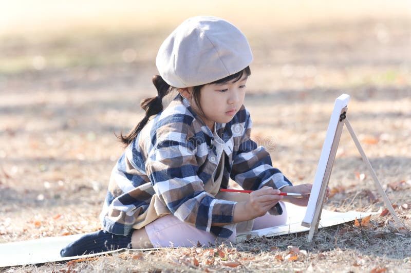 A girl drawing a picture stock photo. Image of smile - 344483710