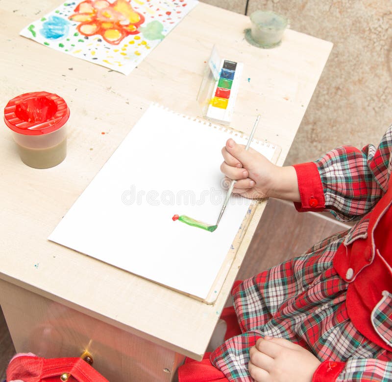A Girl Draws a Drawing with Paints on a Sheet Stock Image - Image of ...