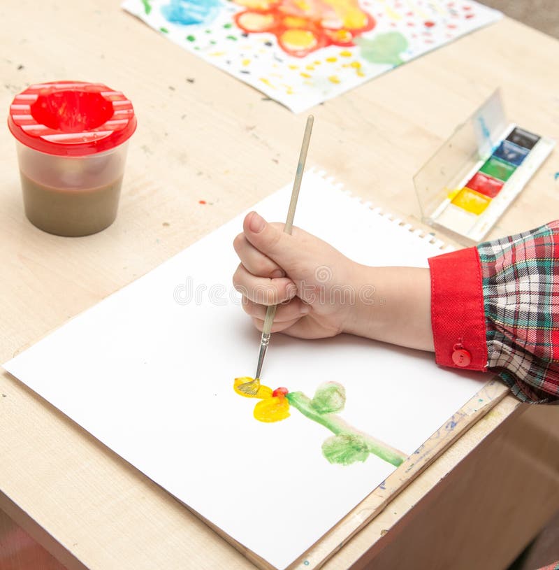 A Girl Draws a Drawing with Paints on a Sheet Stock Image - Image of ...