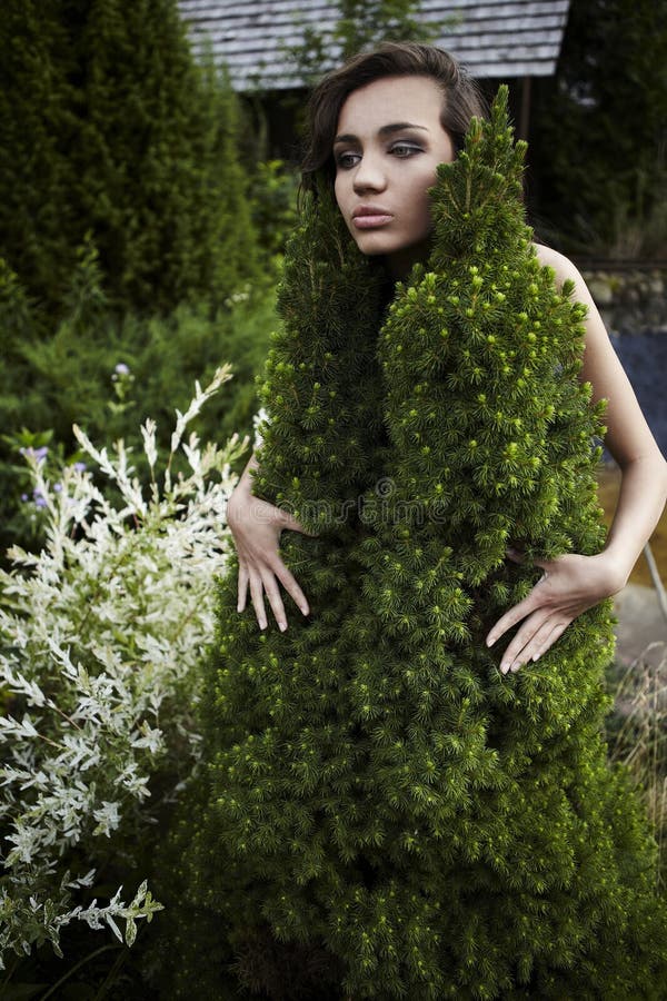 The Girl in a Dress from a Decorative Fur-tree. Stock Photo - Image of ...