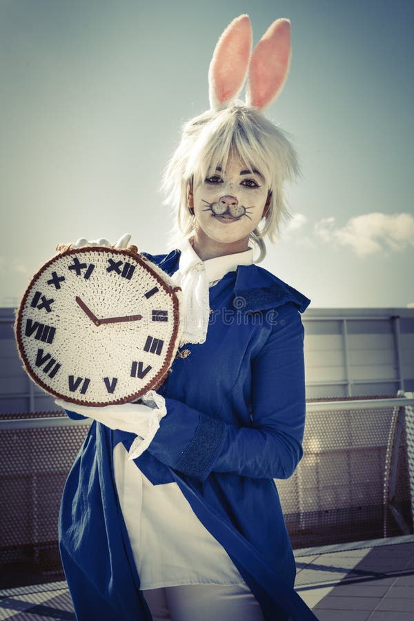 Girl Dressed As a Rabbit with Clock. Stock Image - Image of ears ...