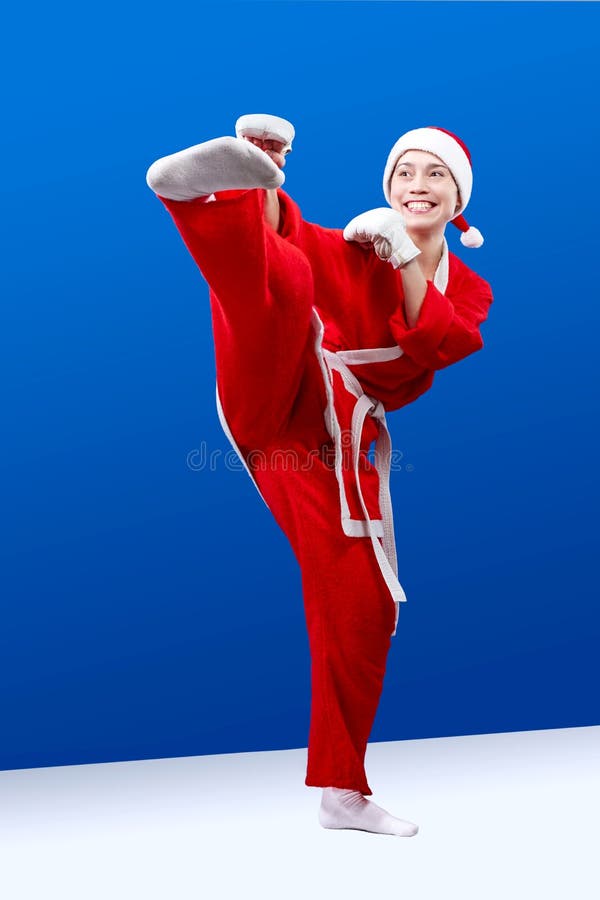 A Girl Dressed As Santa Claus Doing Karate Kick Stock Image - Image of ...