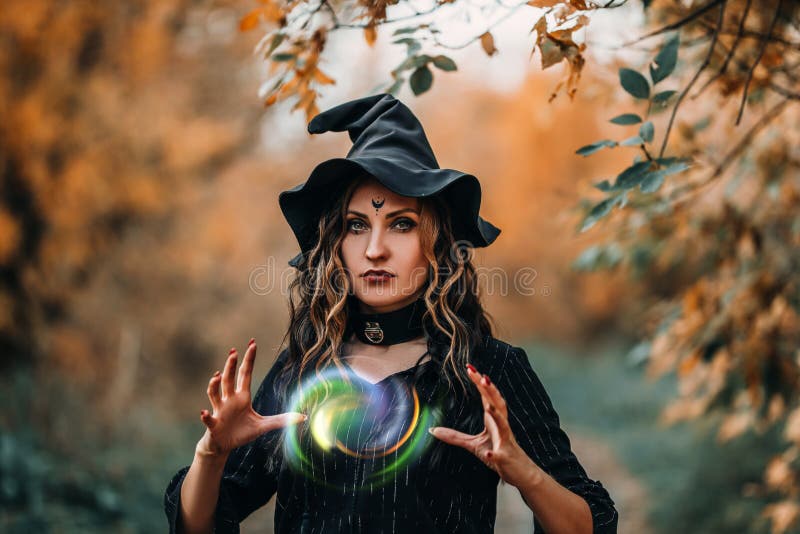 Girl Dressed As Witch Casts Spell in the Form of Sphere in Front of the ...