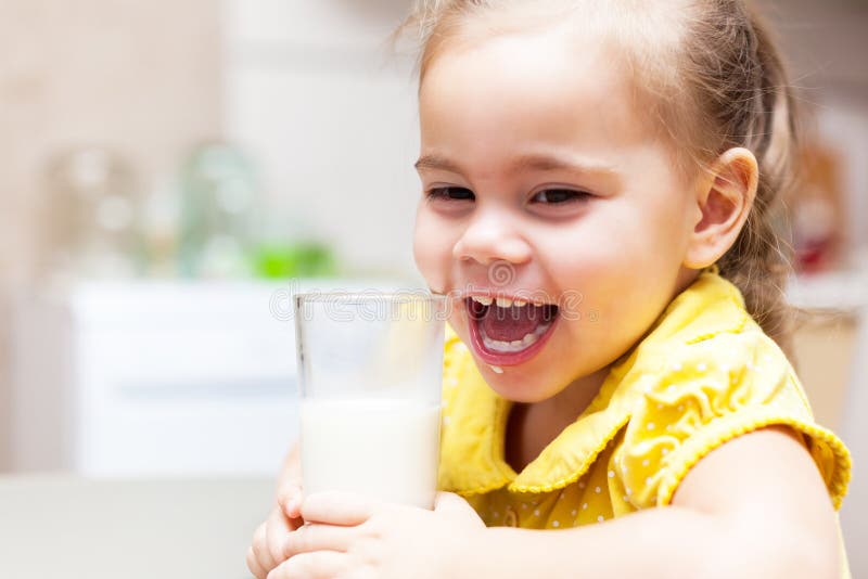 Girl Drinking Milk at the Kitchen Stock Image - Image of cheerful, face ...