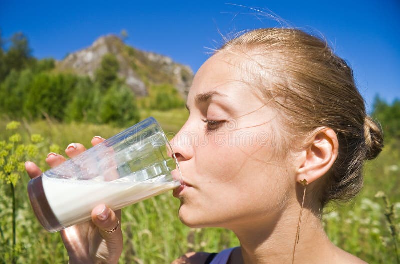 Girl drinks milk. stock photo. Image of summer, women - 17779890